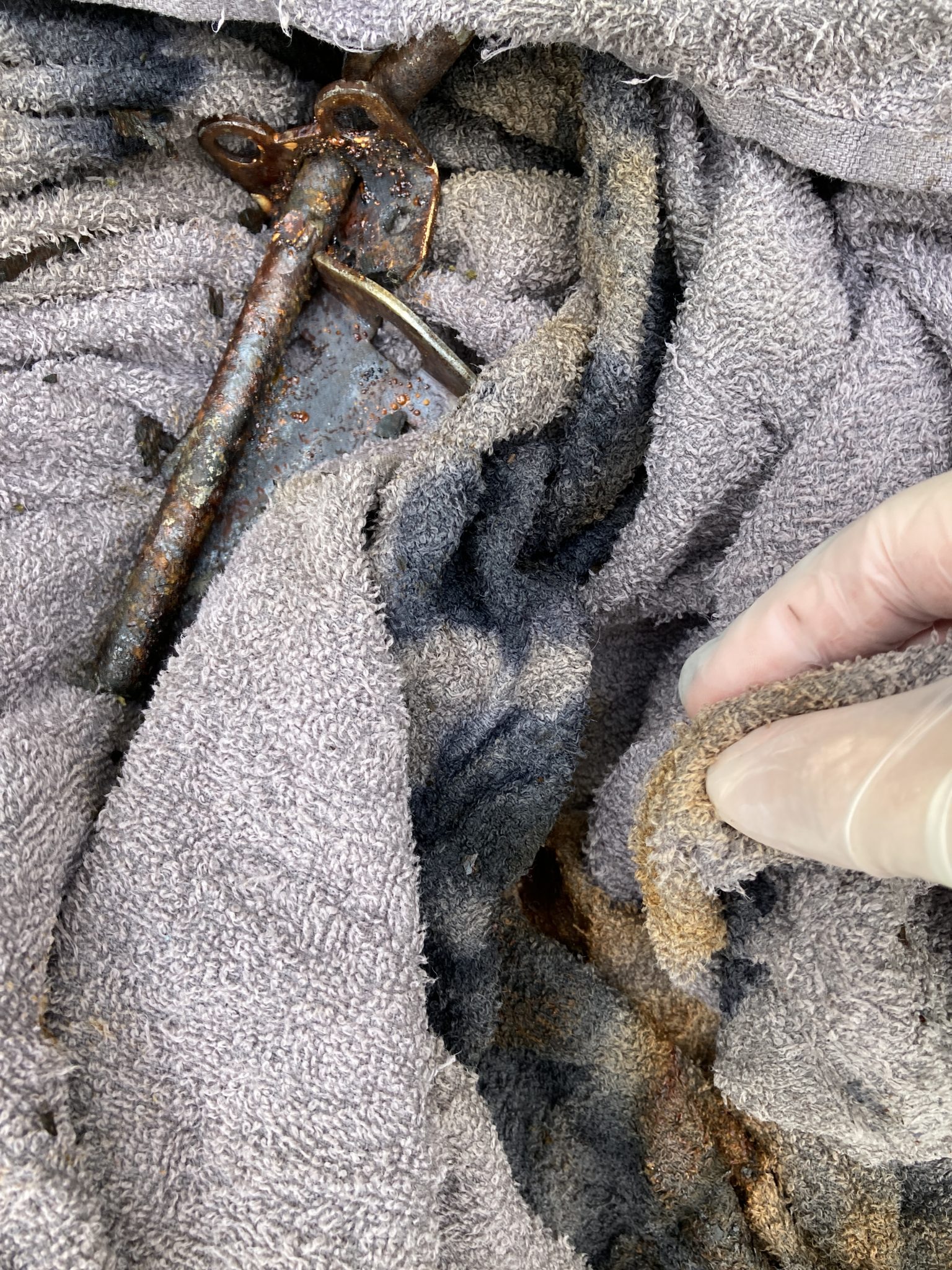 Towelling with rusting dis-used objects from home – Wendy Lawson